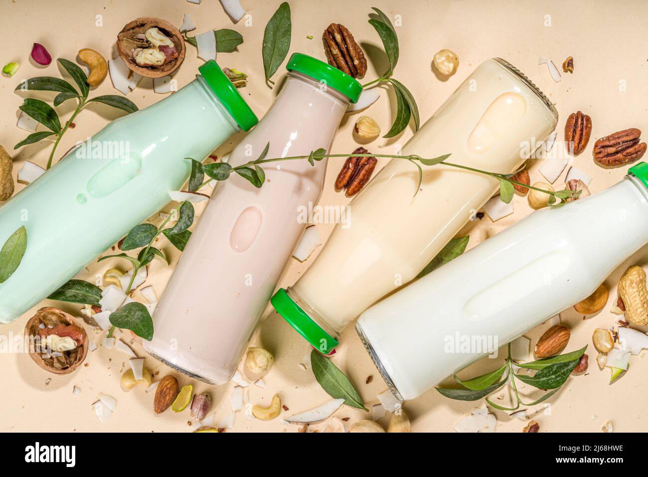 keto, paleo and vegan diet concept. Set of nut milks, bottles with ...