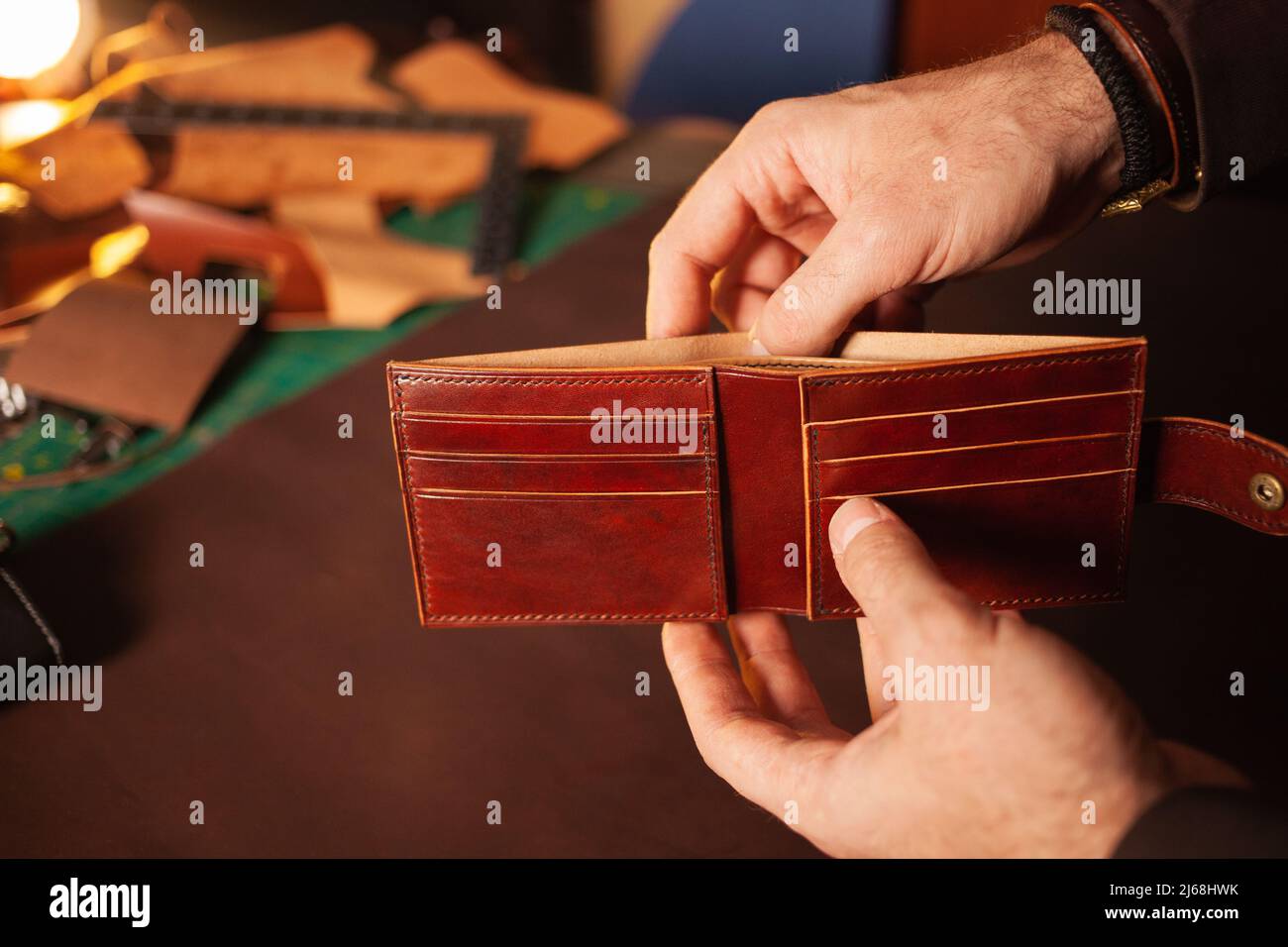 Beautiful genuine leather purse, workshop Stock Photo - Alamy