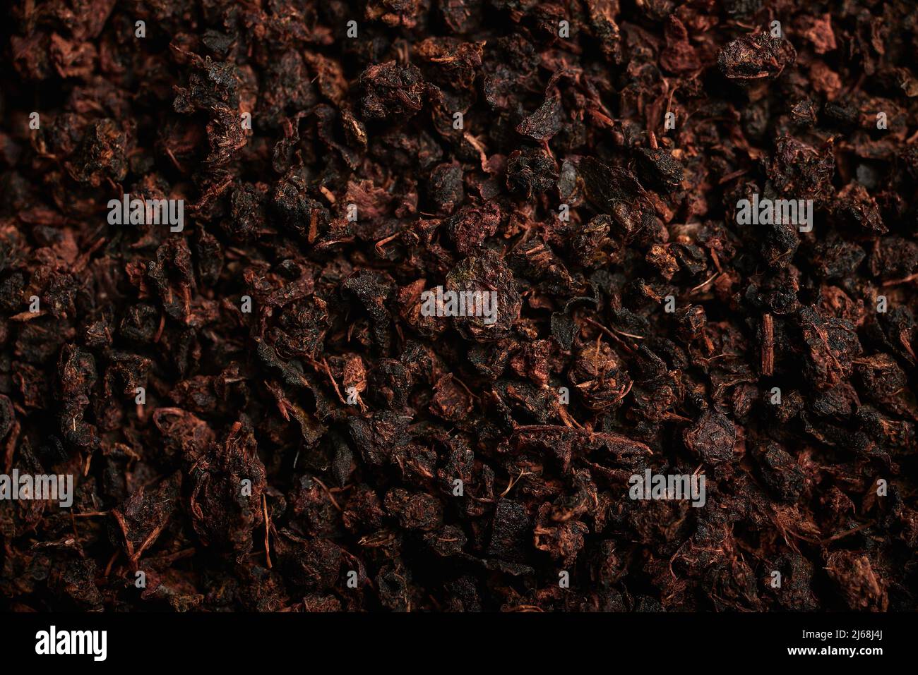 dried tea leaves close up. Black tea loose marco background Stock Photo ...