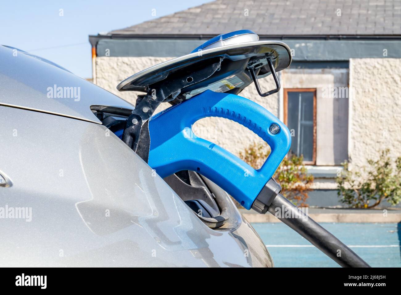 Electric Car on charching station plugged in Dungloe, County Donegal ...