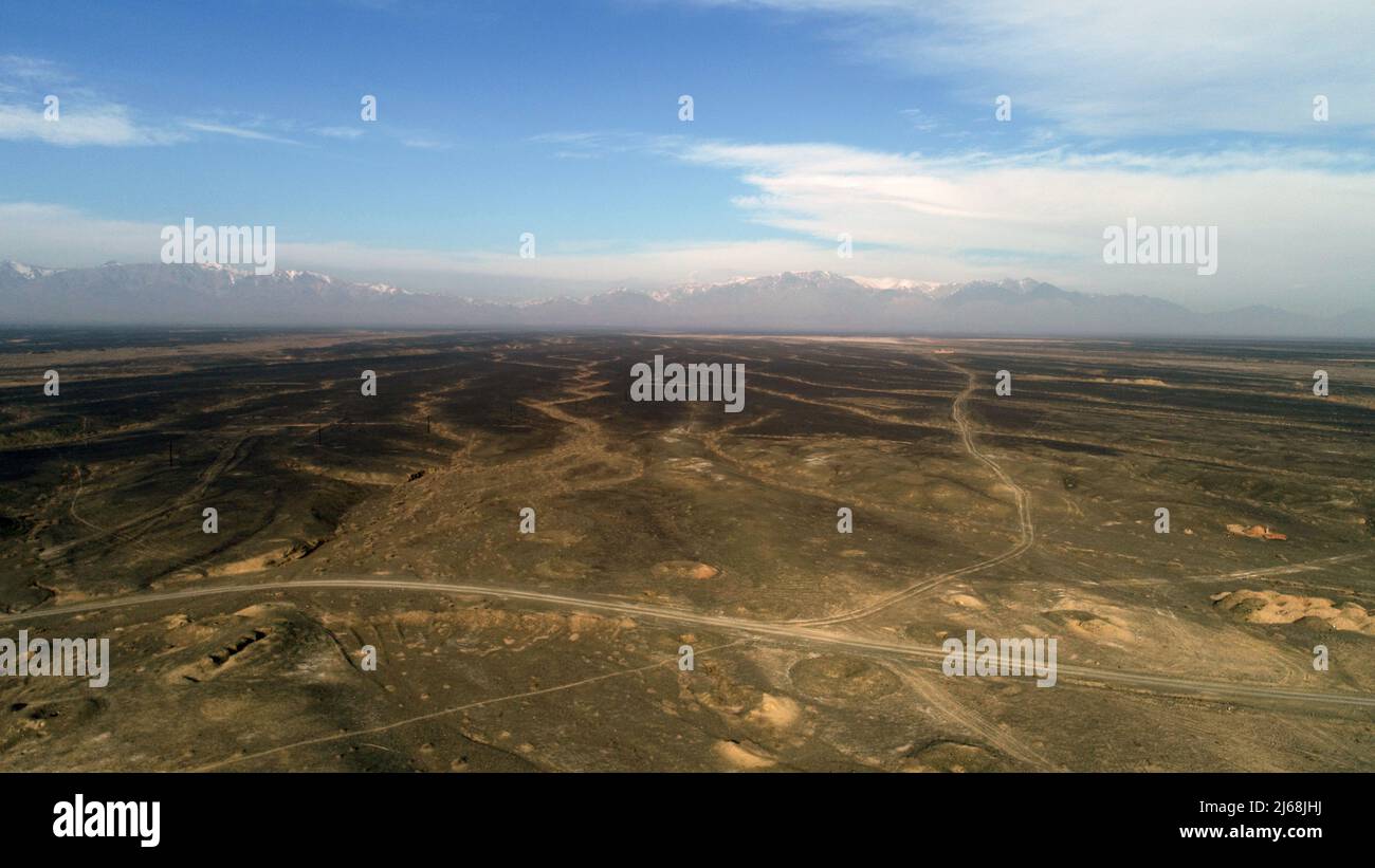 Xinjiang hami aerial snow mountain diluvial fan of the gobi Stock Photo ...