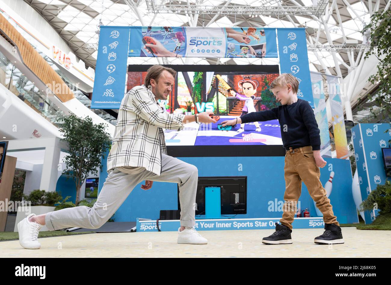 EDITORIAL USE ONLY Actor Tom Felton is joined by Teddy Hutton, seven ...