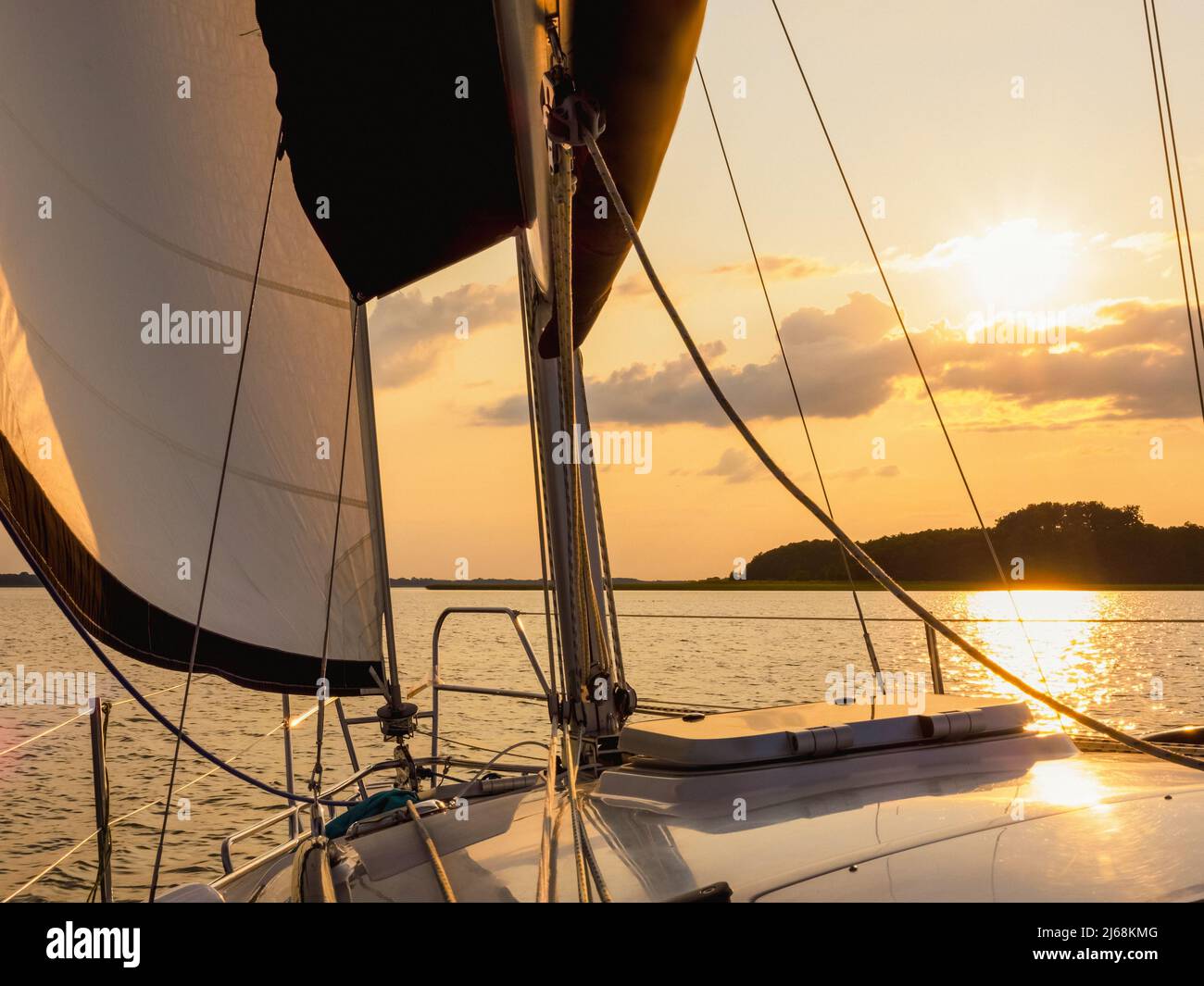 sailing yacht bow in sunset light, sailing on a lake Stock Photo - Alamy