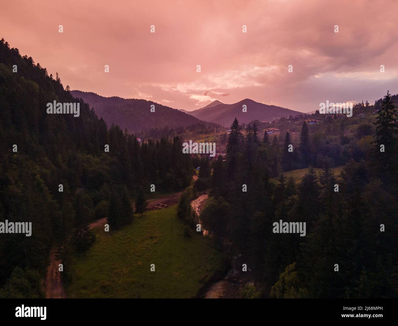 Overcast sunset above mountains hi-res stock photography and images - Alamy