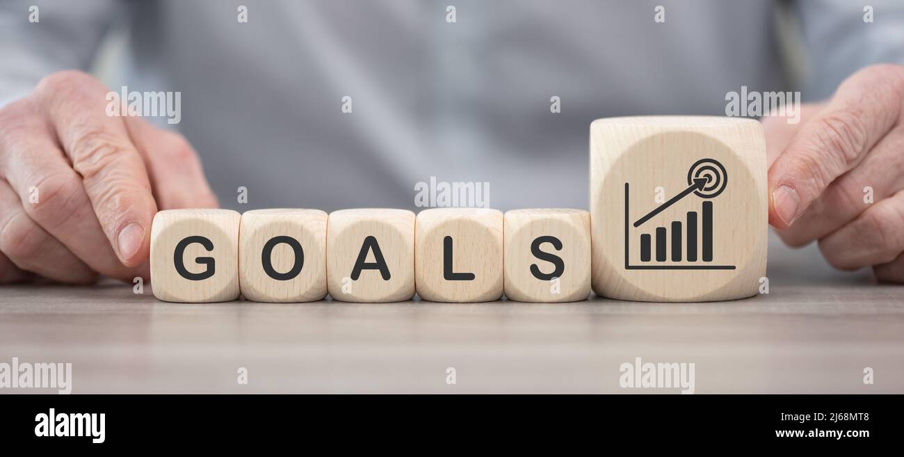 Wooden blocks with symbol of goals concept Stock Photo - Alamy