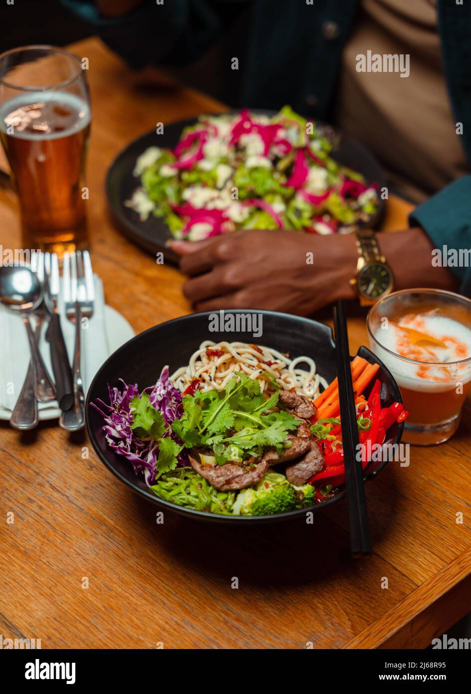 Young adult vegan meal eating hi-res stock photography and images - Alamy