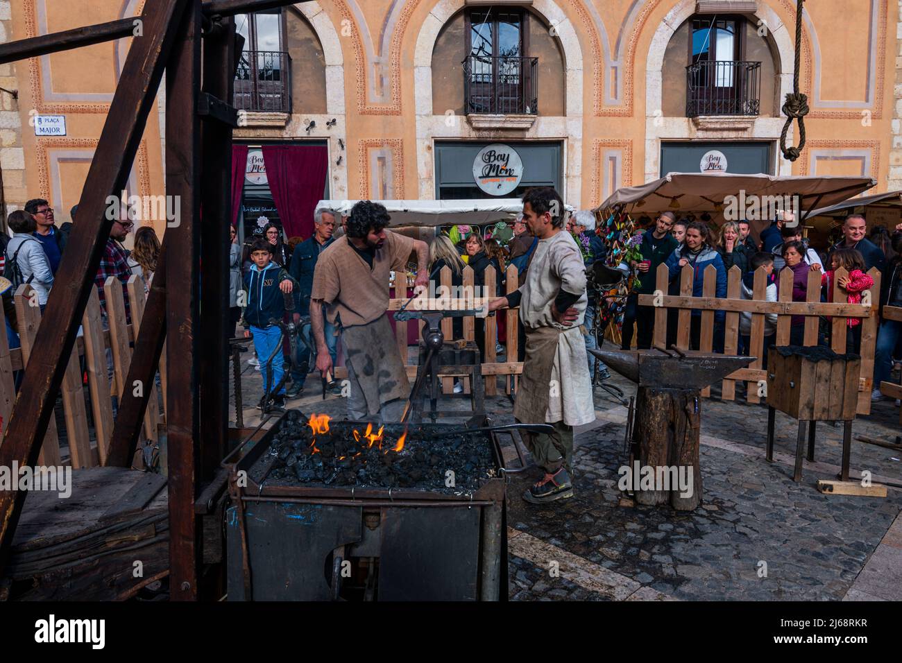 the medieval fair of Montblanc, with children playing as ancient ...