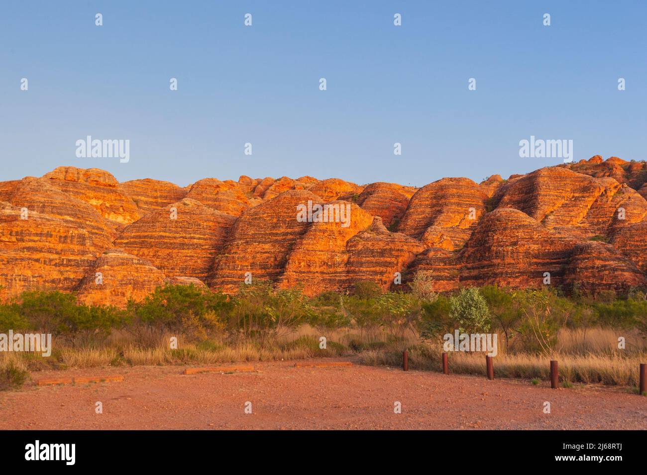 Stunning view of glowing sandstone karst domes at sunrise, Purnululu ...