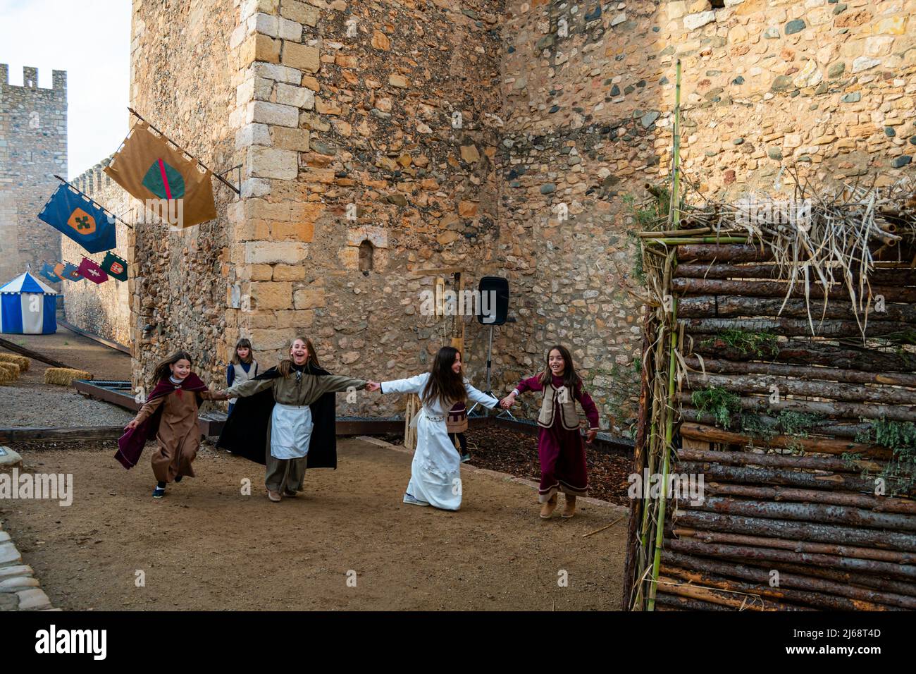 the medieval fair of Montblanc, with children playing as ancient ...