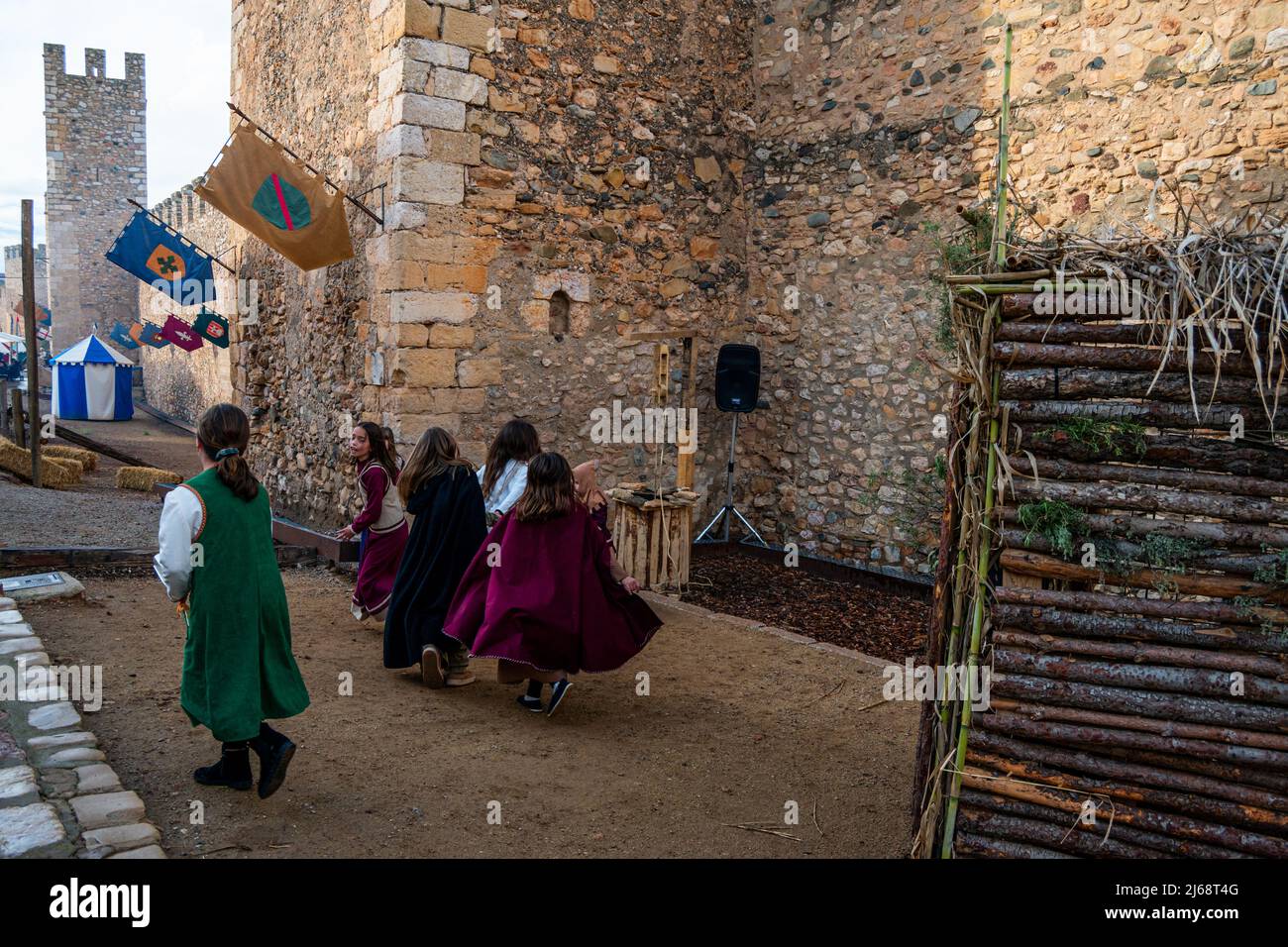 the medieval fair of Montblanc, with children playing as ancient ...