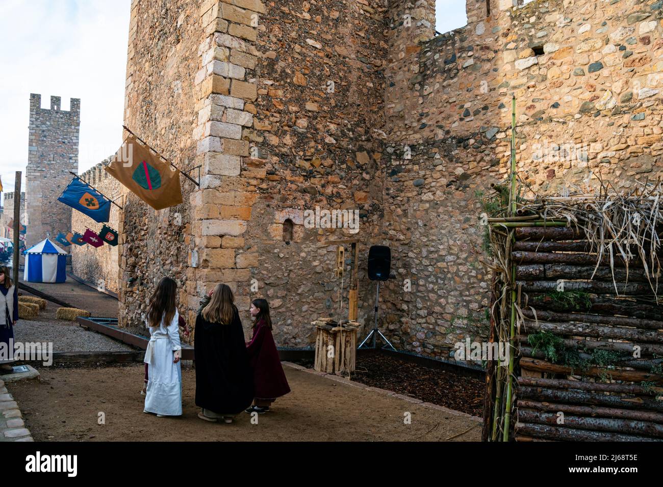 the medieval fair of Montblanc, with children playing as ancient ...