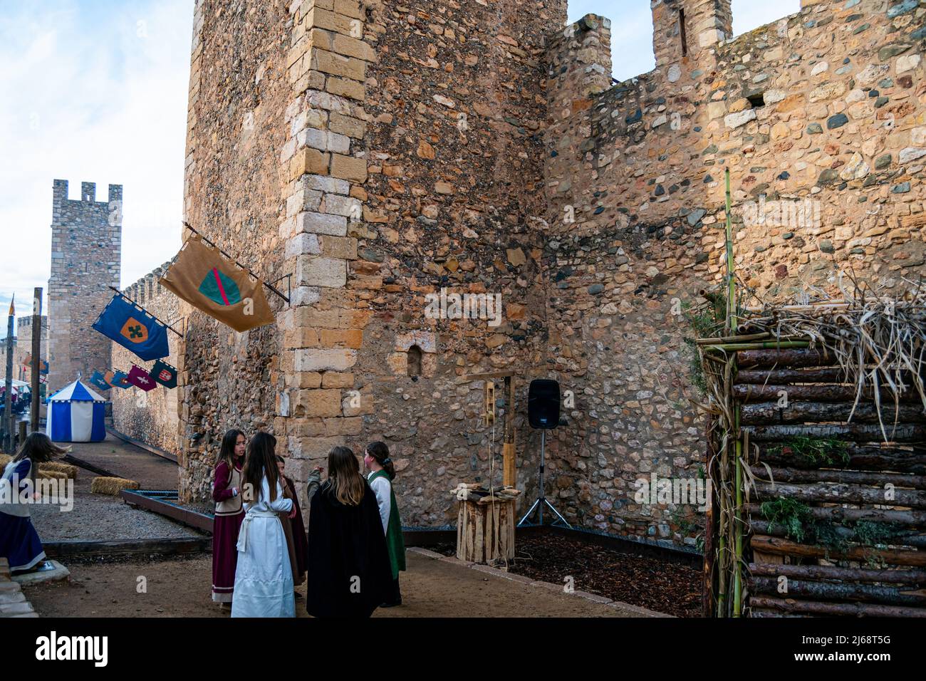 the medieval fair of Montblanc, with children playing as ancient ...