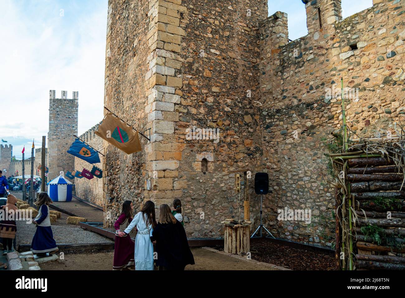 the medieval fair of Montblanc, with children playing as ancient ...