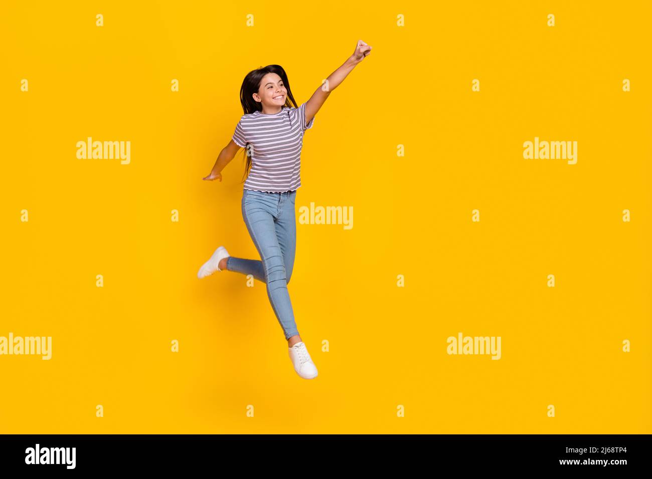 Full size photo of young cheerful girl jump fly power look empty space ...
