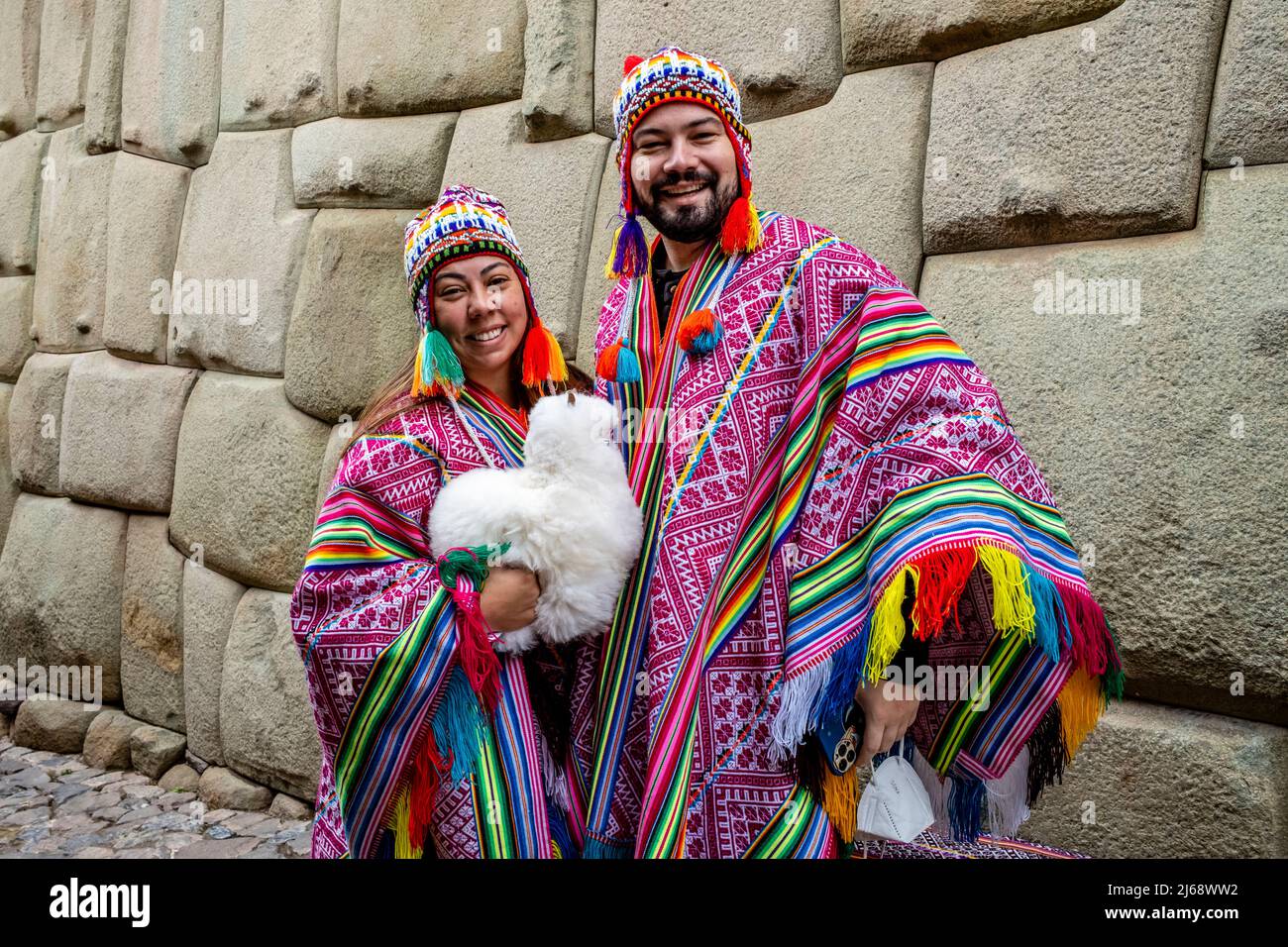 Toursts/Visitors Dressed In Colourful Peruvian Costume Pose For A Photo ...