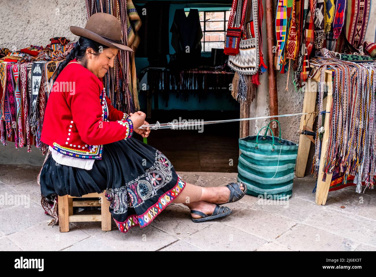 An Indigenous Woman Showing The Traditional Method Of Weaving Wool In ...