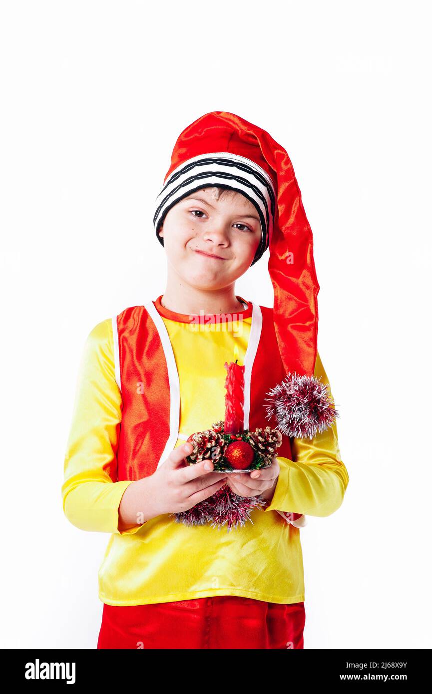 A baby dressed as a elf. isolated. Santa's helper. boy in suit of dwarf ...