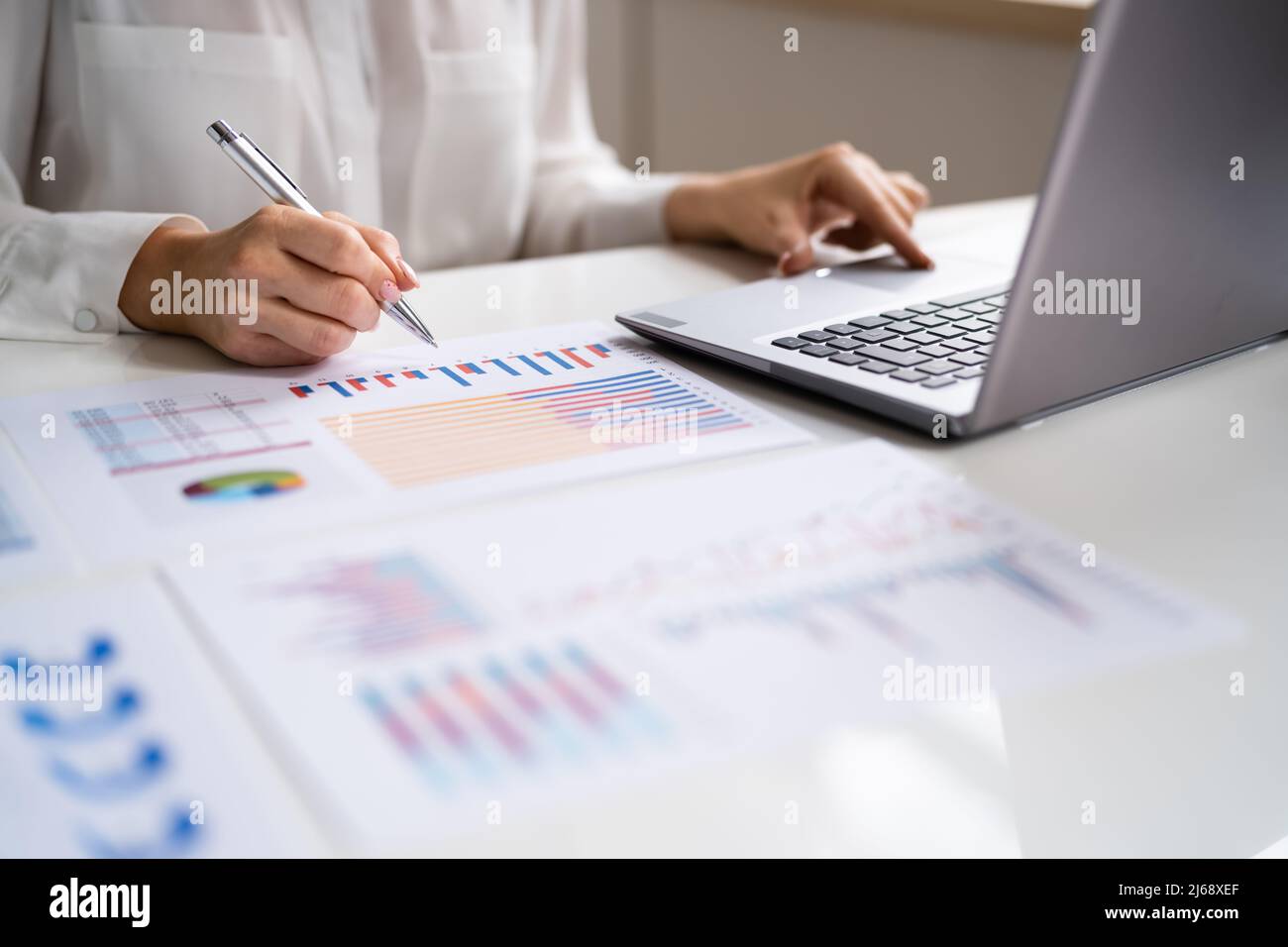 Business Accountant Using Finance Chart Document And Calculator Stock ...