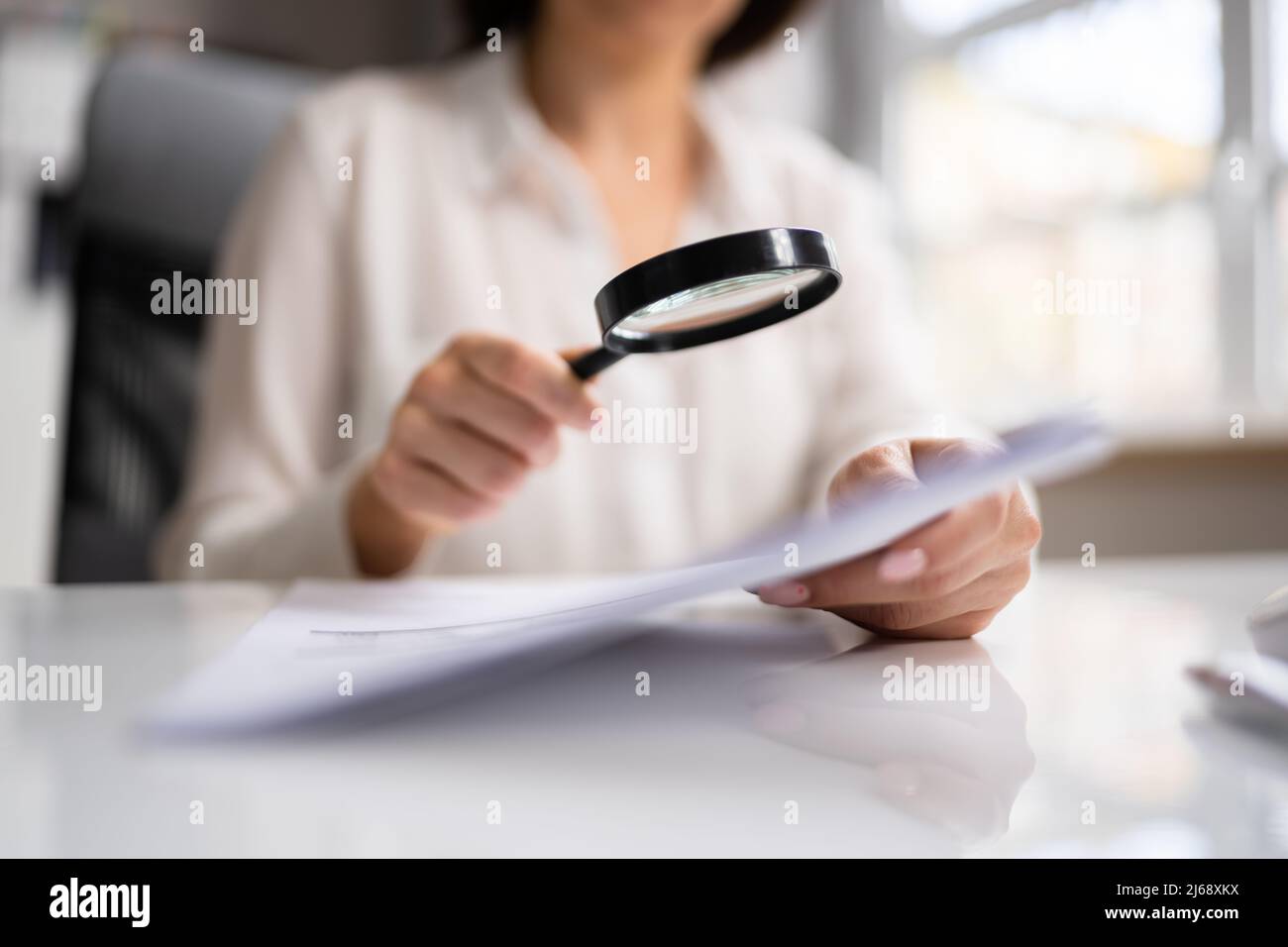 Auditor Doing Tax Fraud Investigation Using Magnifying Glass Stock ...