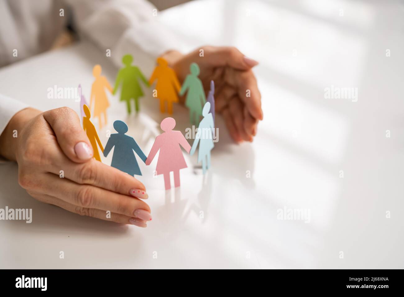 Protecting People Figures. Community Protection And Safety Stock Photo ...