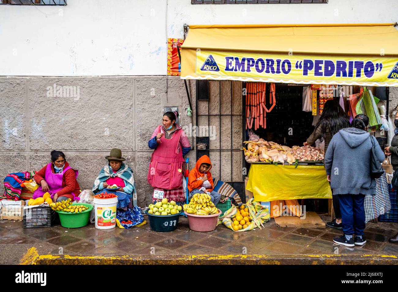 Local Women Selling Fruit At An Outdoor Street Market In Cusco, Cusco ...
