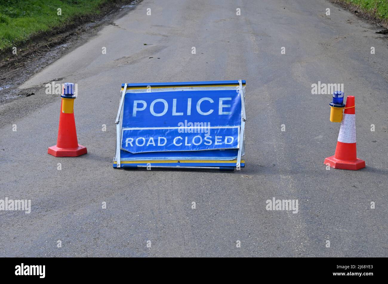 Police "Road Closed" sign on a road leading out of the north ...