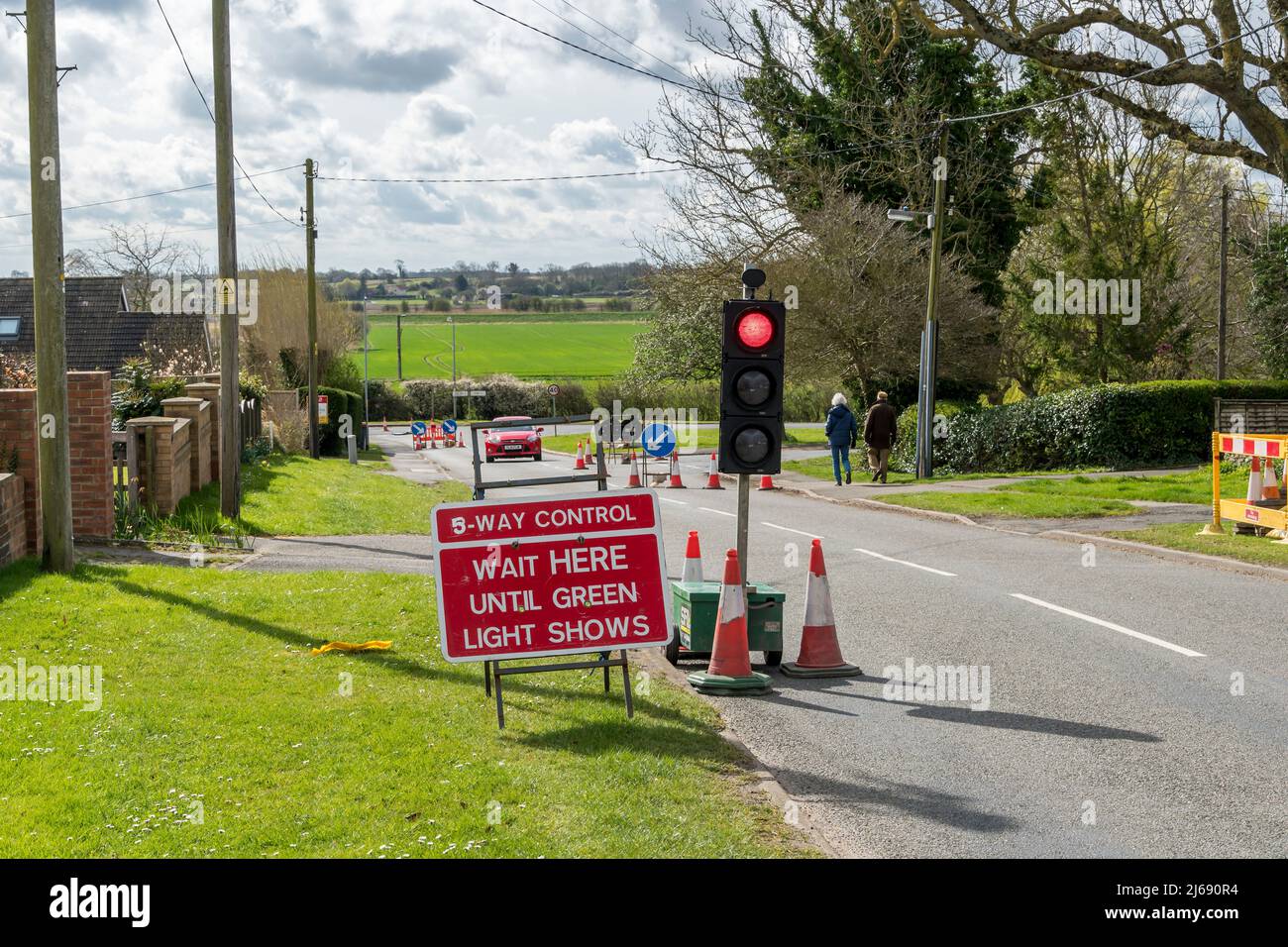 Temporary traffic control lights at road works Stock Photo - Alamy