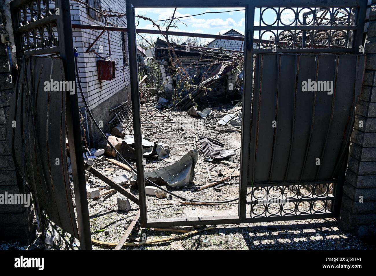 ZAPORIZHZHIA, UKRAINE - APRIL 28, 2022 - Rubble covers the yard of a ...