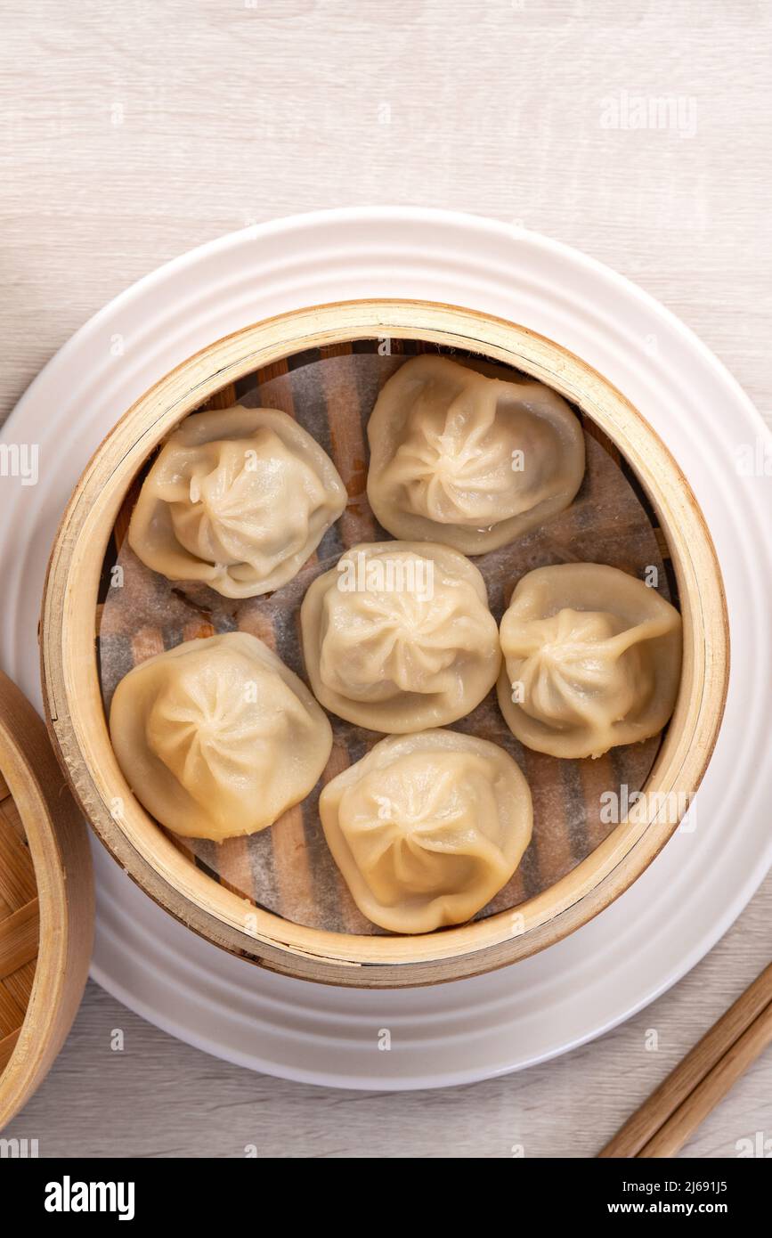Eating steamed pork soup dumplings named Xiao long bao xiaolongbao in ...