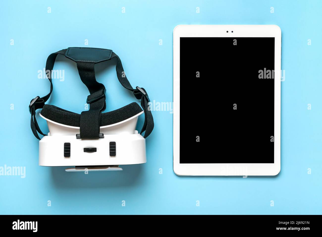white tablet with black screen display, vr glasses for virtual reality ...