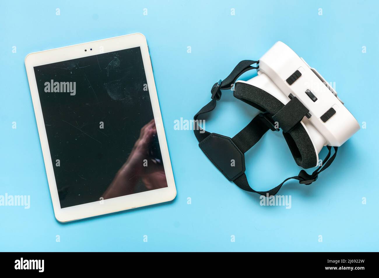 white tablet with black screen display, vr glasses for virtual reality ...