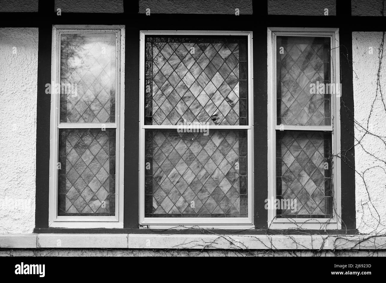 Vintage leaded glass window with diagonal lines in black and white ...