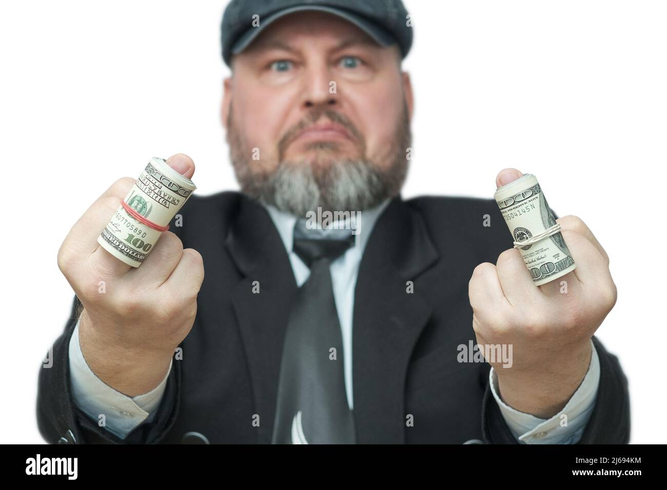 A man shows the middle finger on which dollars are rolled up into a ...