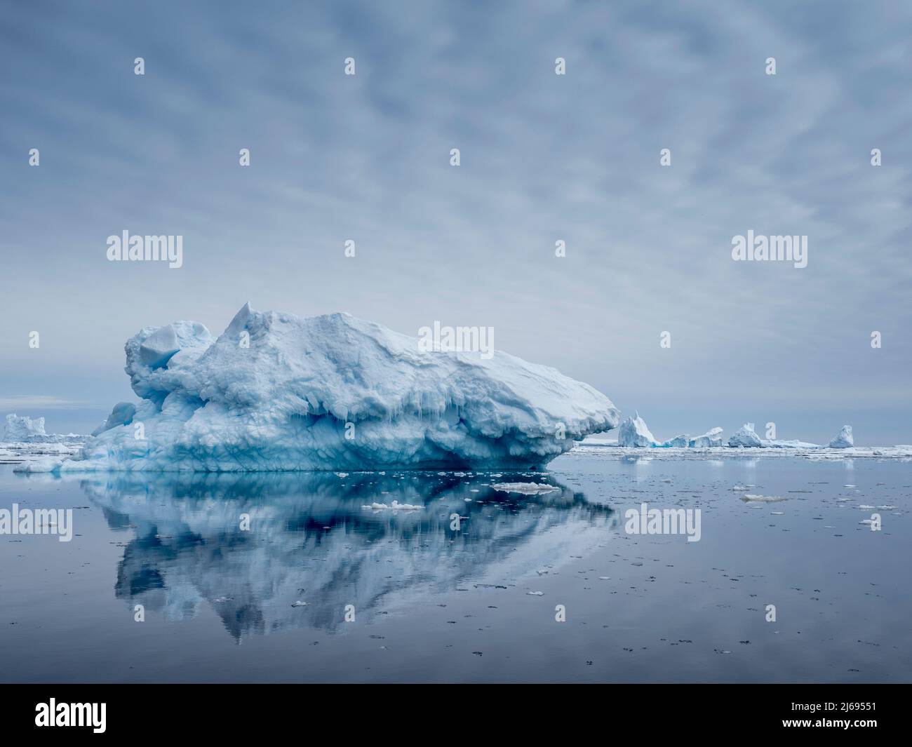 Large iceberg grounded on a reef at Peter I Island, Bellingshausen Sea ...