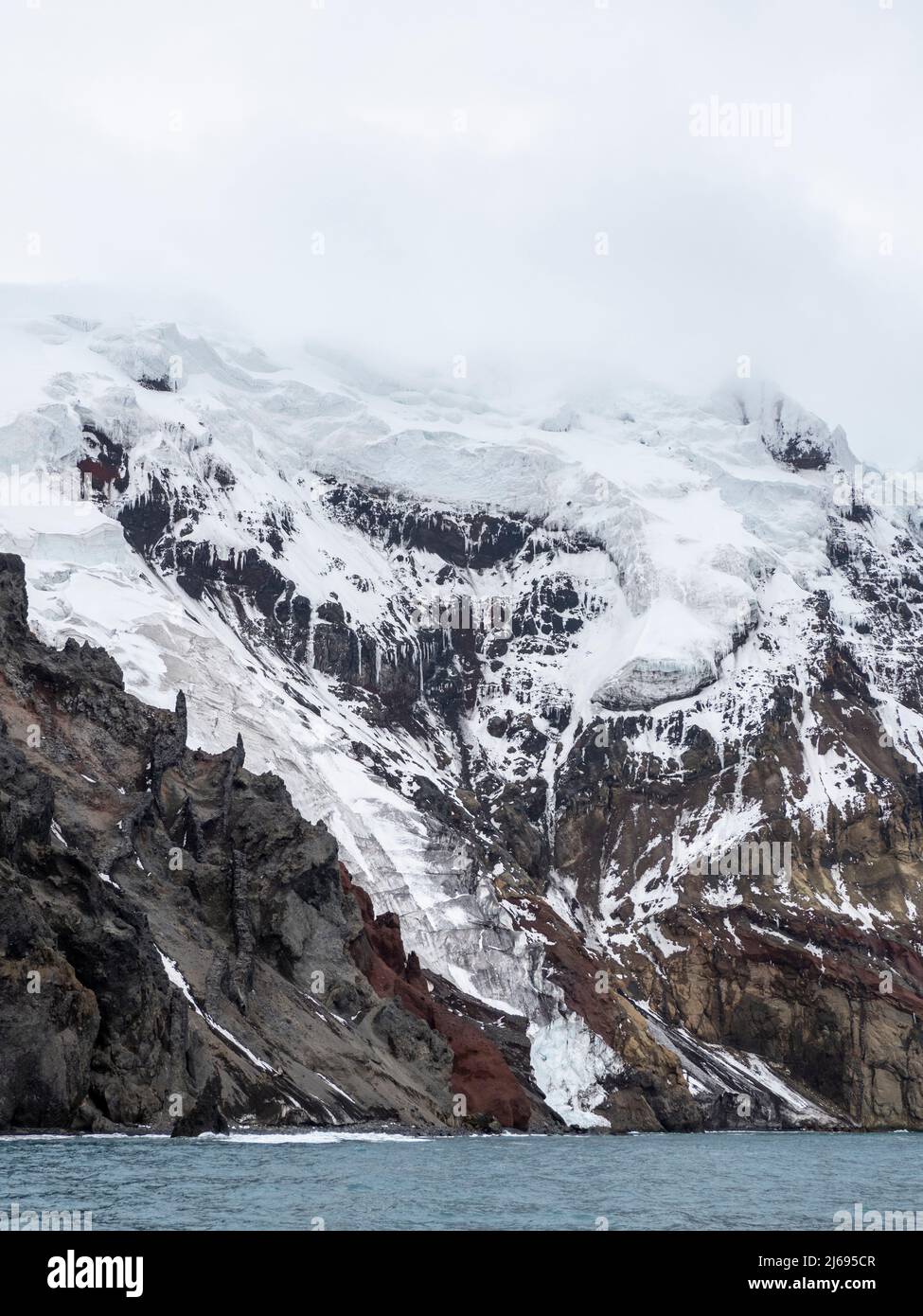 Ice covered mountains on Thule Island, a volcanic island in the South ...