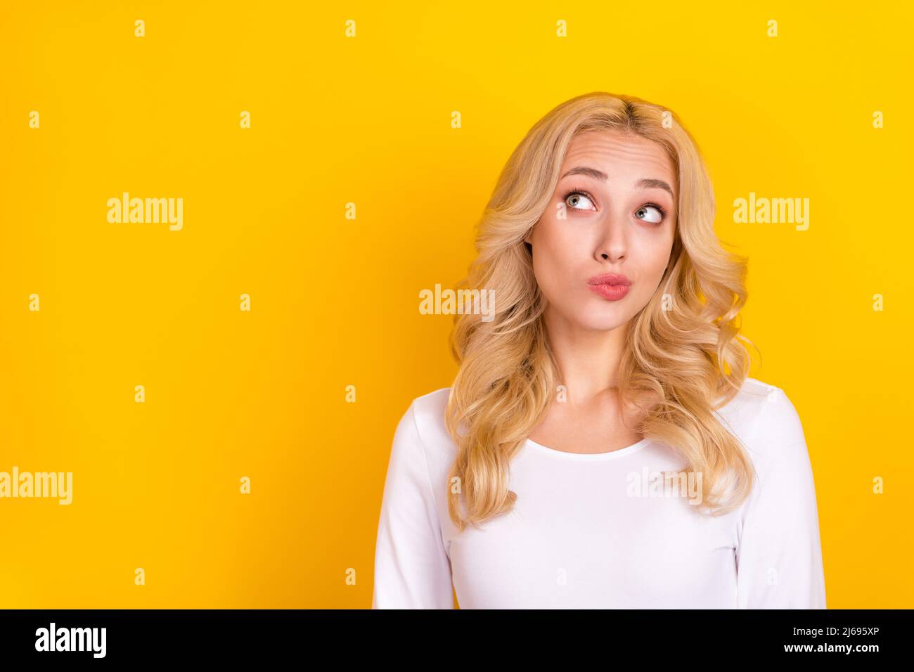 Photo of pretty suspicious lady dressed white shirt looking empty space ...