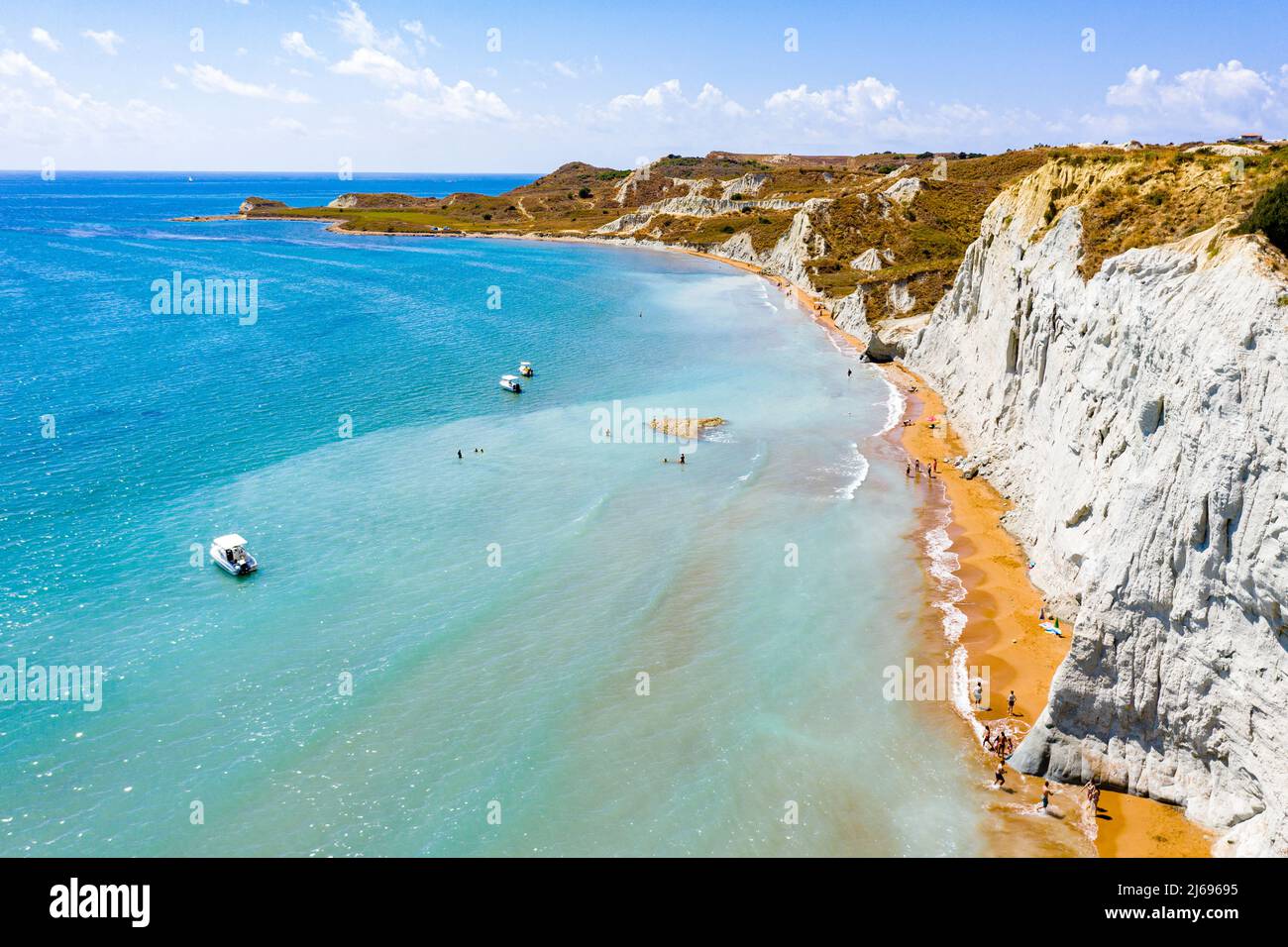 Aerial view of majestic limestone cliffs framing the golden sand of Xi ...
