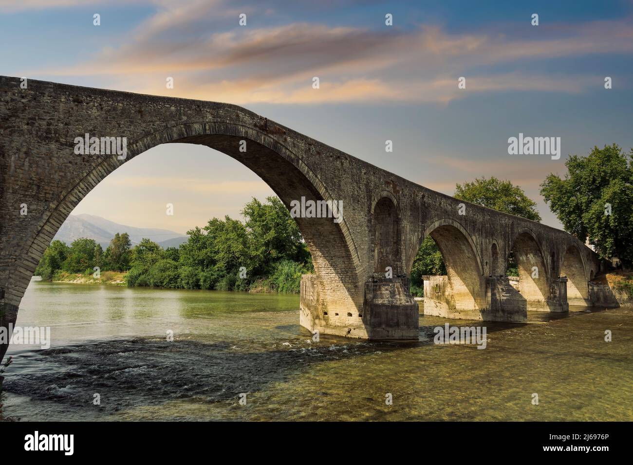 Day view of historic stone bridge of Arta above the Arachthos River ...