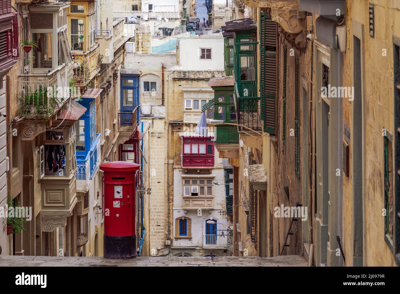 Typical street scene of alley with traditional homes, colorful ...