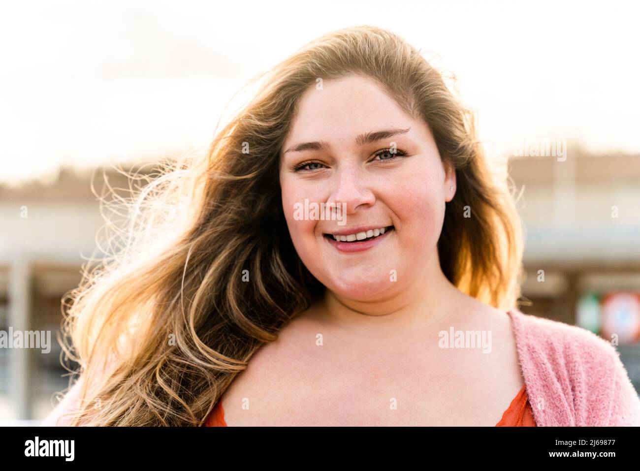 Beautiful and cheerful plus size young woman outdoors - Pretty ...