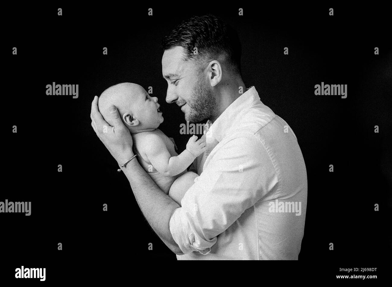 Two men with a baby hi-res stock photography and images - Alamy