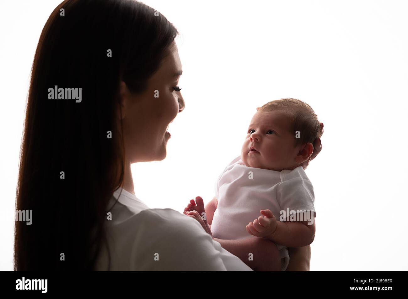 Mother with a baby, studio shot, United Kingdom, Europe Stock Photo - Alamy