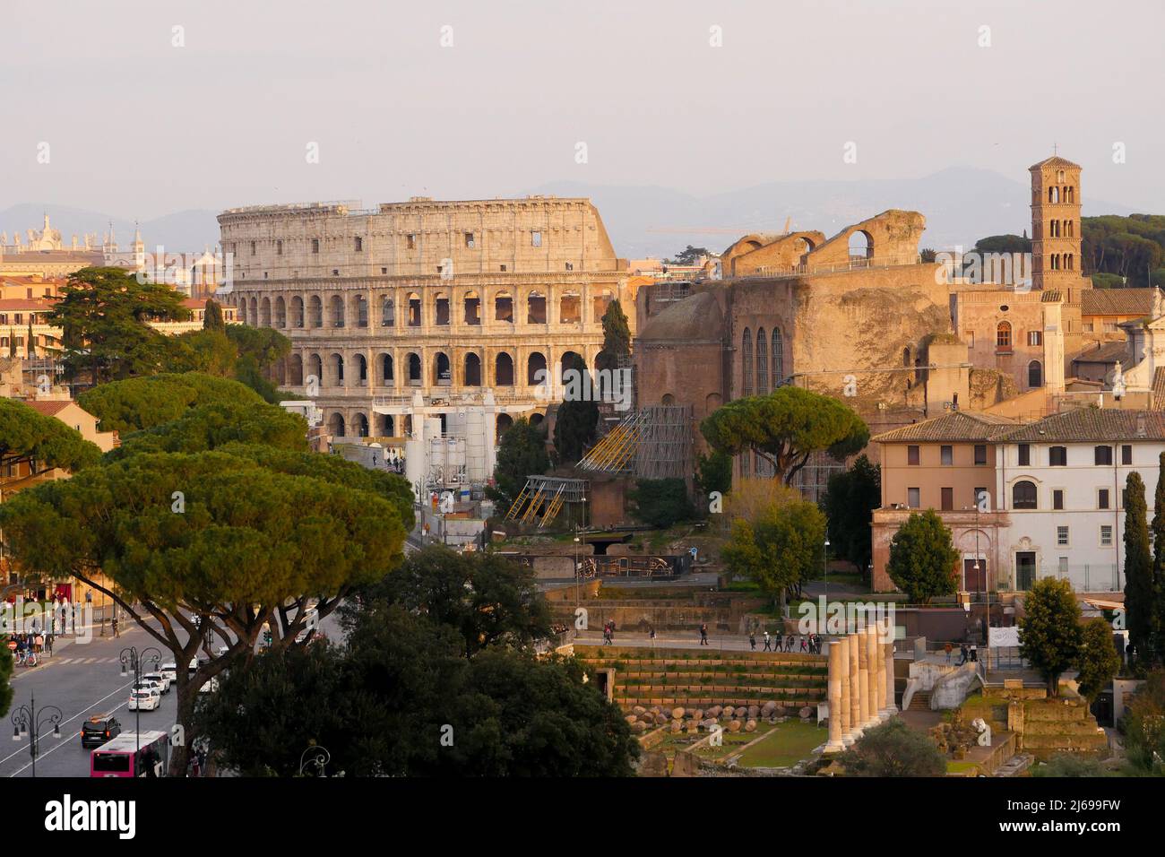 Rome, 03.20.2021, Colosseum at sunset with clouds and cypresses, Rome ...