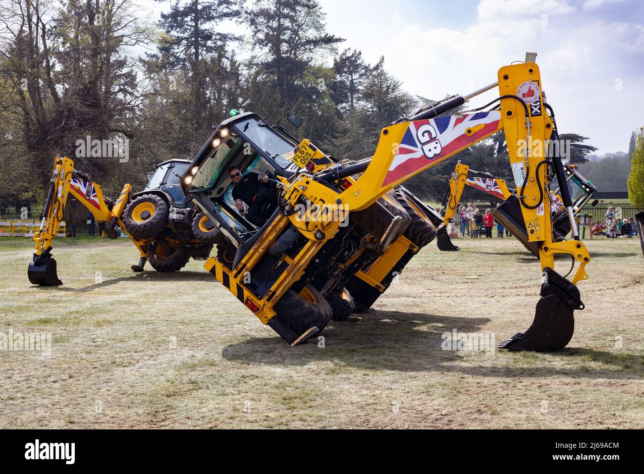 JCB Dancing Diggers display team - heavy machinery showing what it can ...