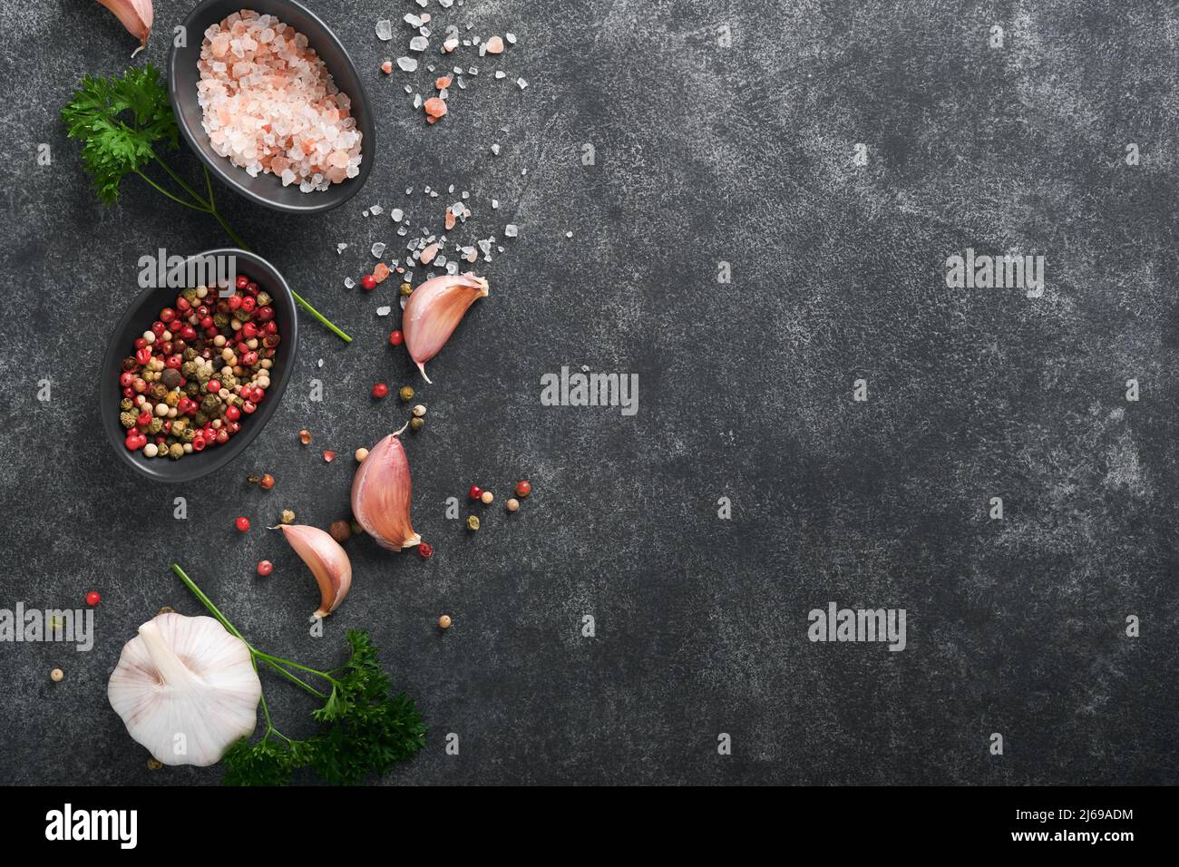 Black food cooking background. Stone texture with sea salt, pepper ...