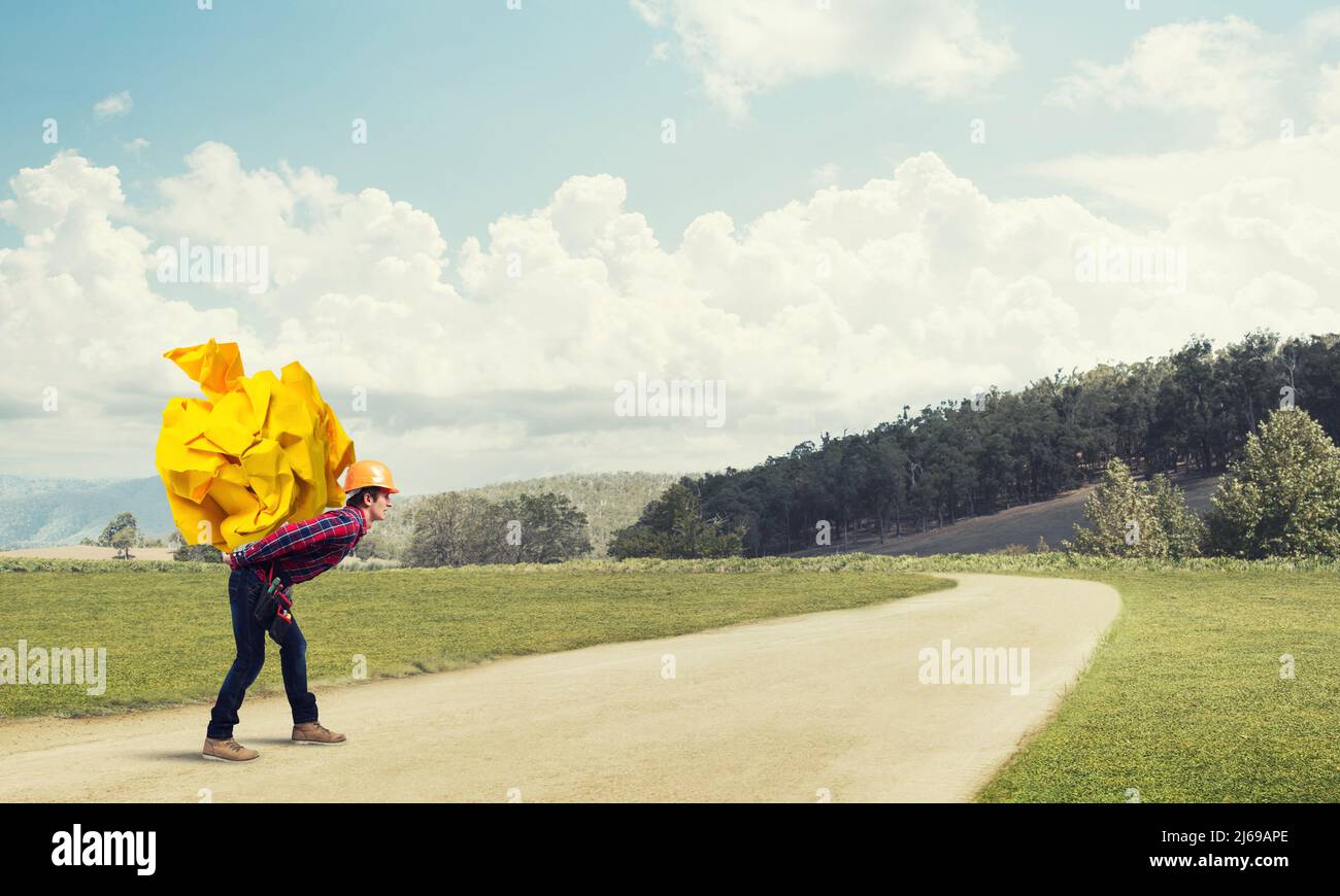 Engineer man carry load Stock Photo - Alamy