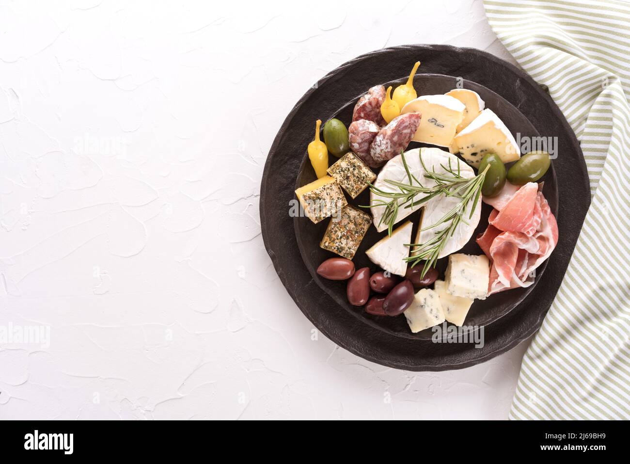 Charcuterie board with assortment of cheeses, salami and prosciutto ...