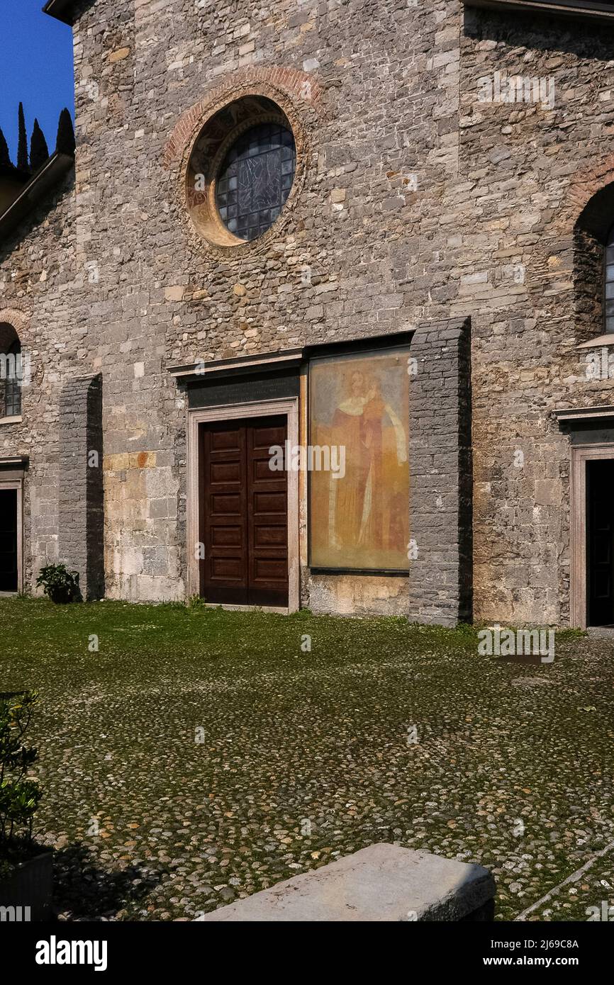 Austere medieval church facade is enhanced by a faded 1300s Lombard ...