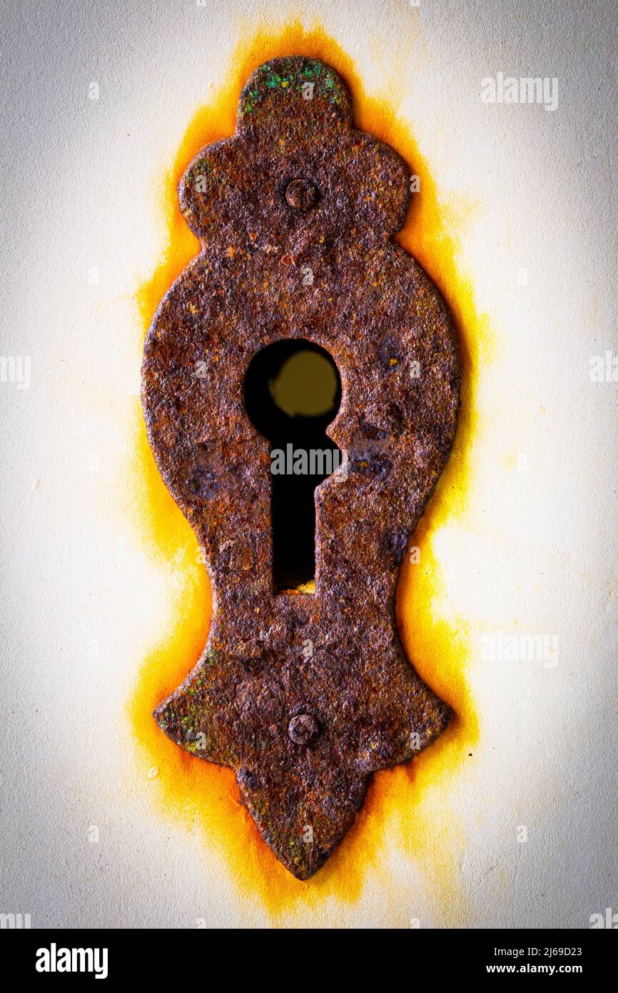 Rusted and weathered key hole in an wooden door. Key hold for opening ...