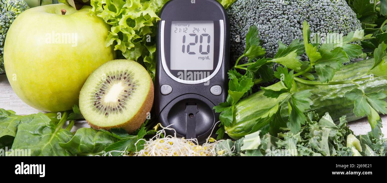 Glucose meter with fresh natural fruits, vegetables and sprouts ...